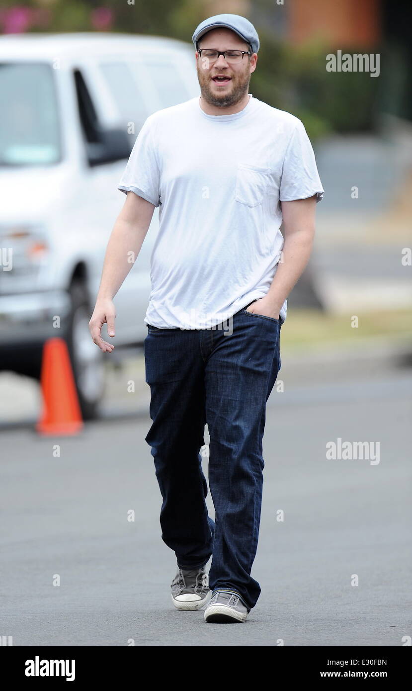 Actor Zac Efron sports a marijuana belt buckle with a white tight t ...