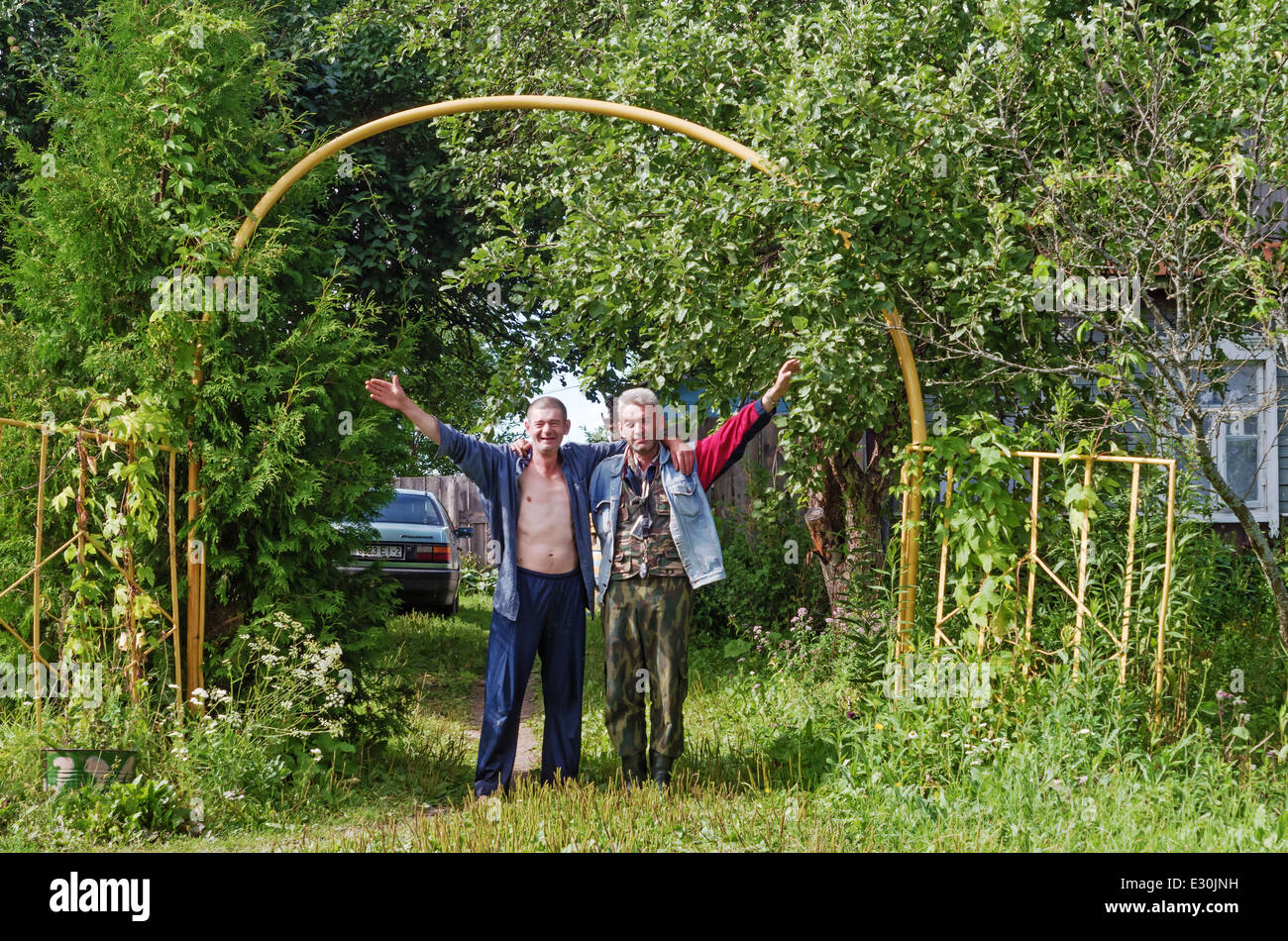 Rural summer lifestyle 2013. Rural friends at gate to the house yard ...