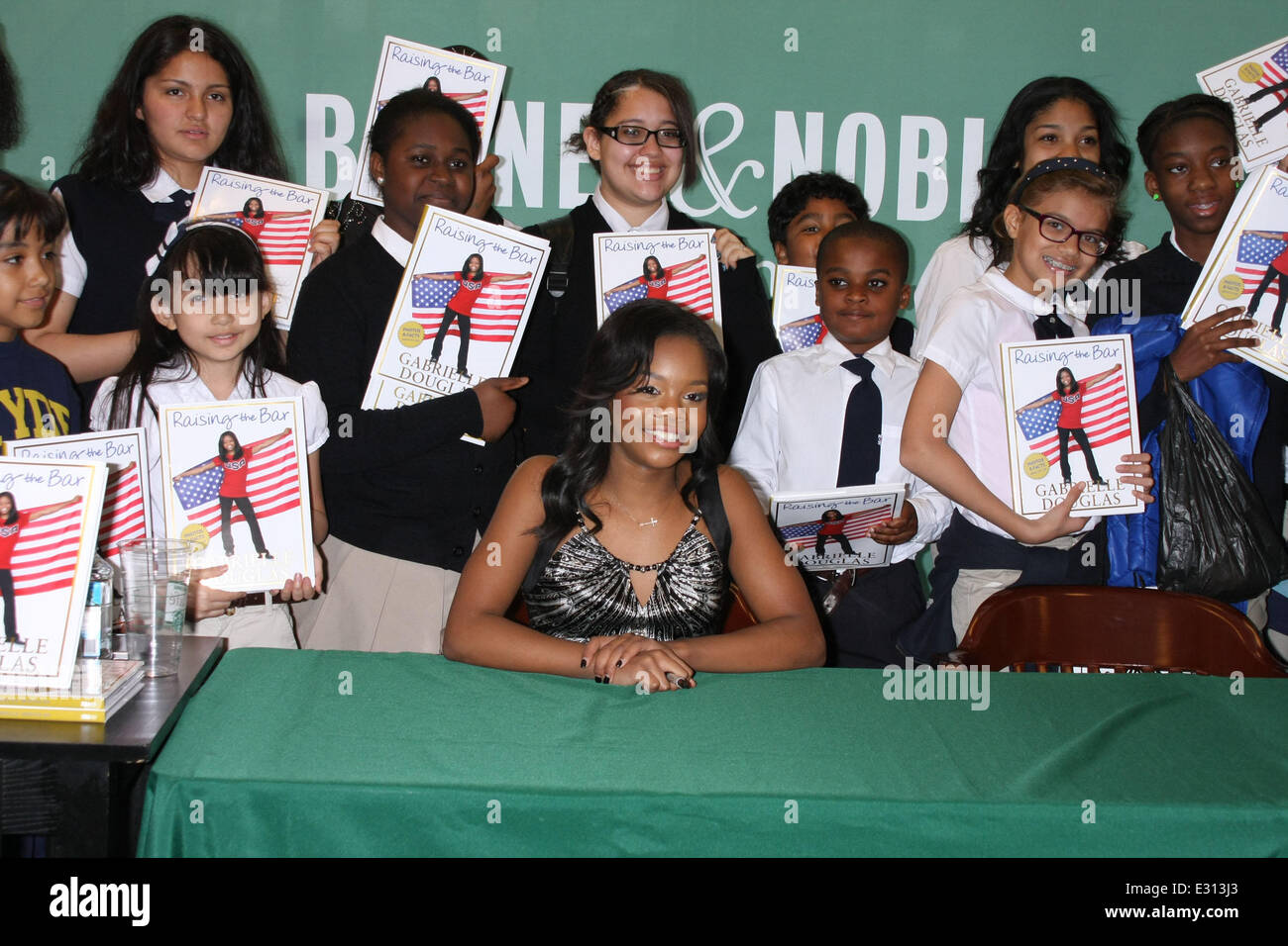 Olympic gold medalist Gabby Douglas signs copies of her new book ...