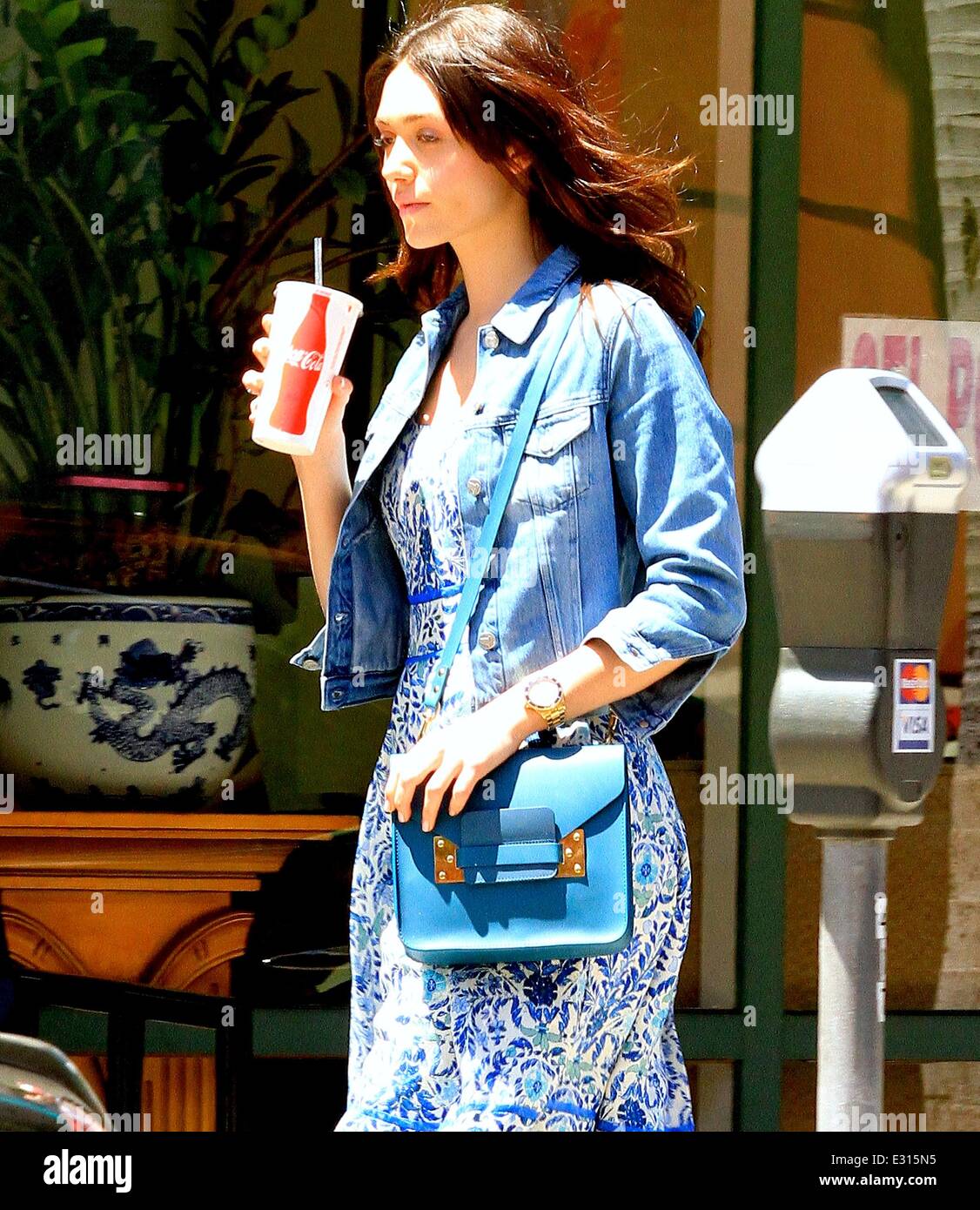 Emmy Rossum out and about on Bedford Drive in Beverly Hills drinking ...