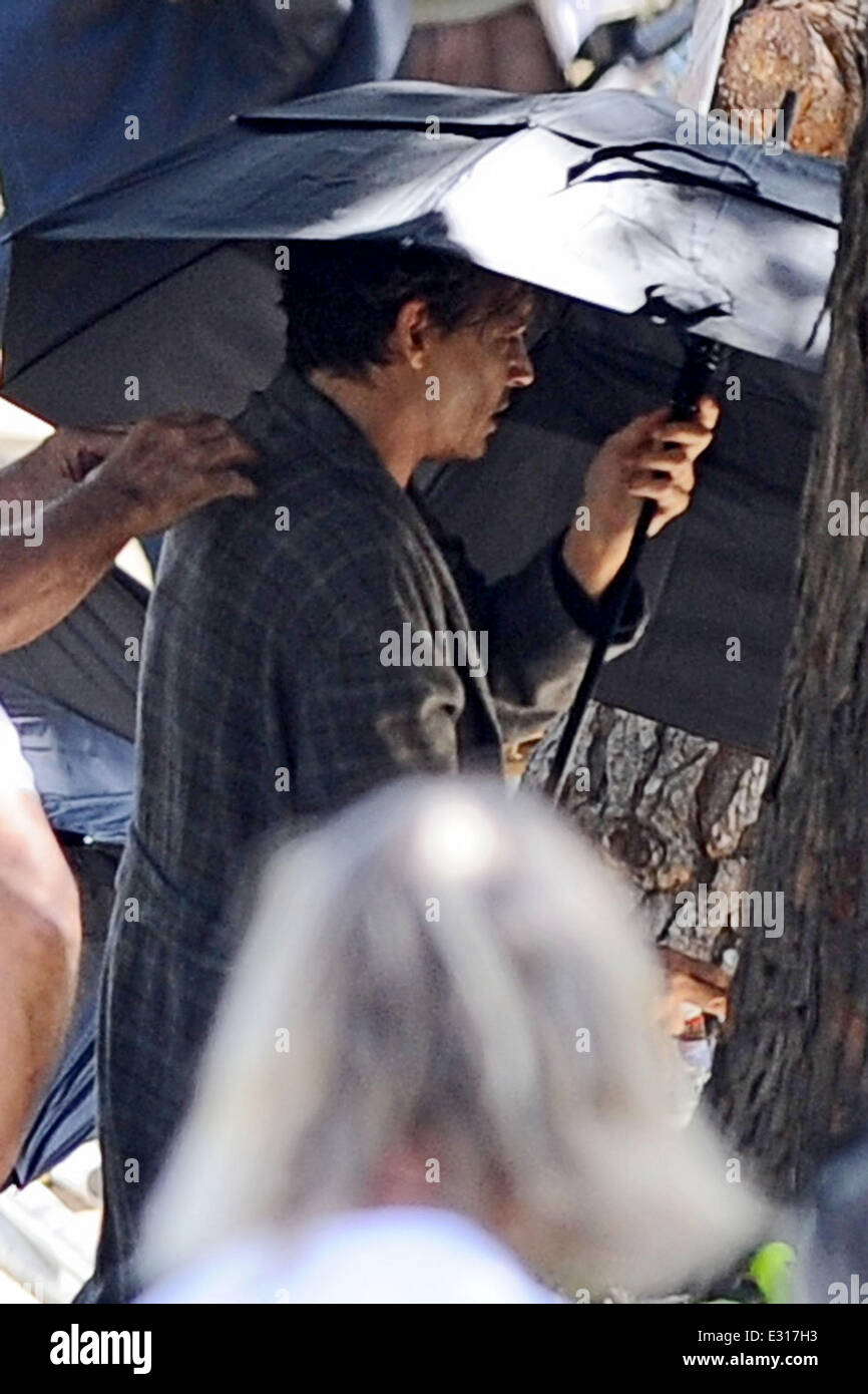 Actor Johnny Depp wearing a robe as he arrives on the set of ...