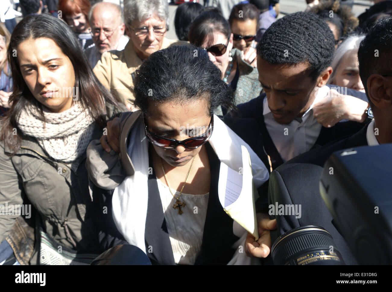 Genet Bekele, center, mother of Robel Phillipos, who is a friend of ...