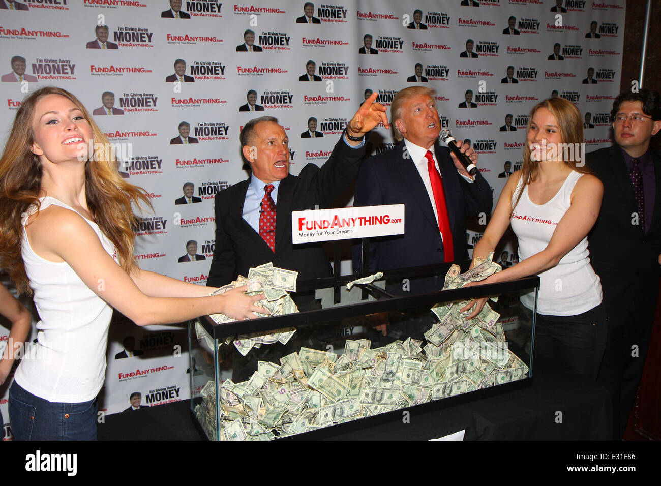 Donald Trump distributes free money at the launch of FundAnything.com ...