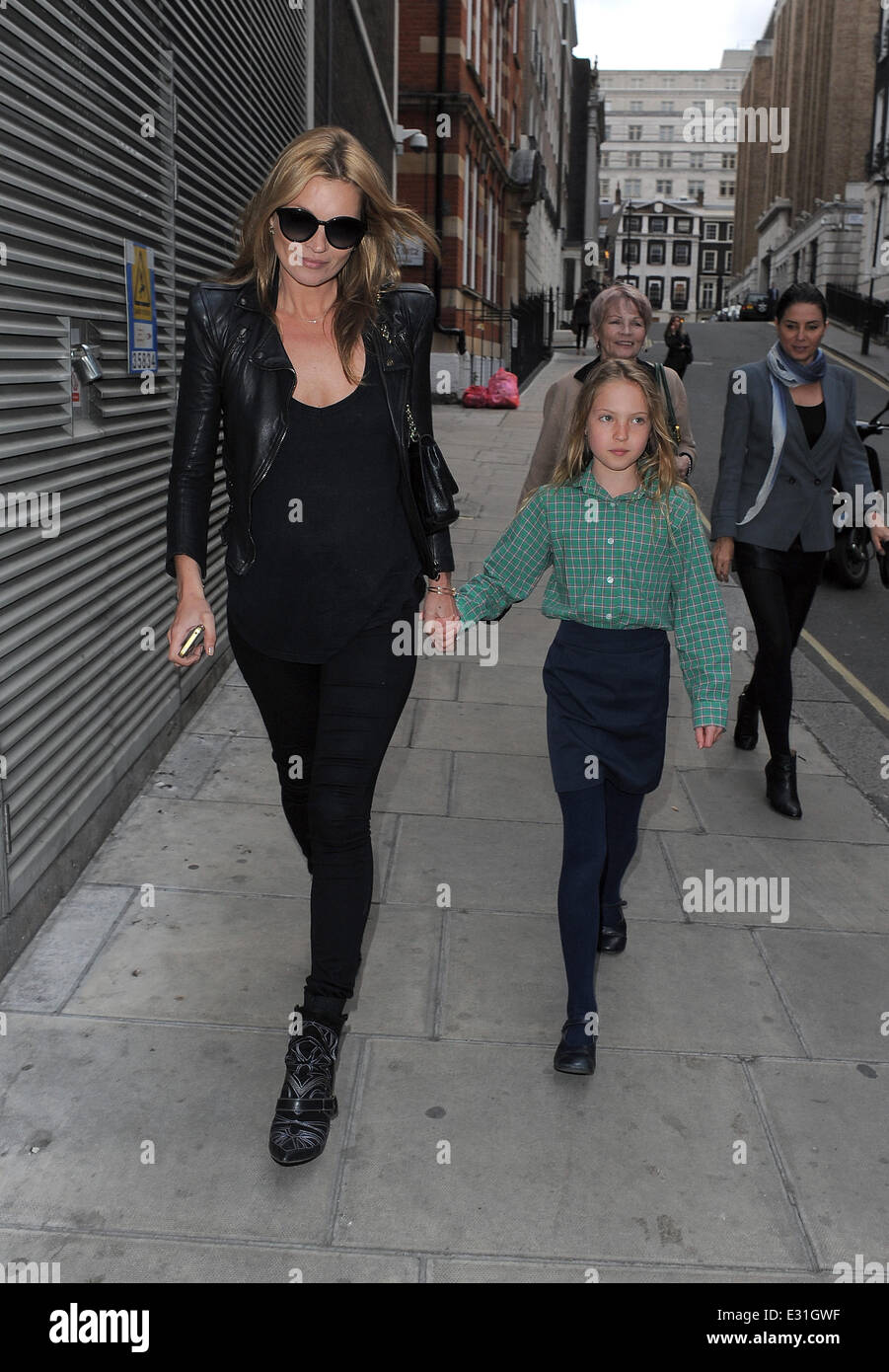 Kate Moss and her daughter Lila Grace Moss attend an exhibition of ...