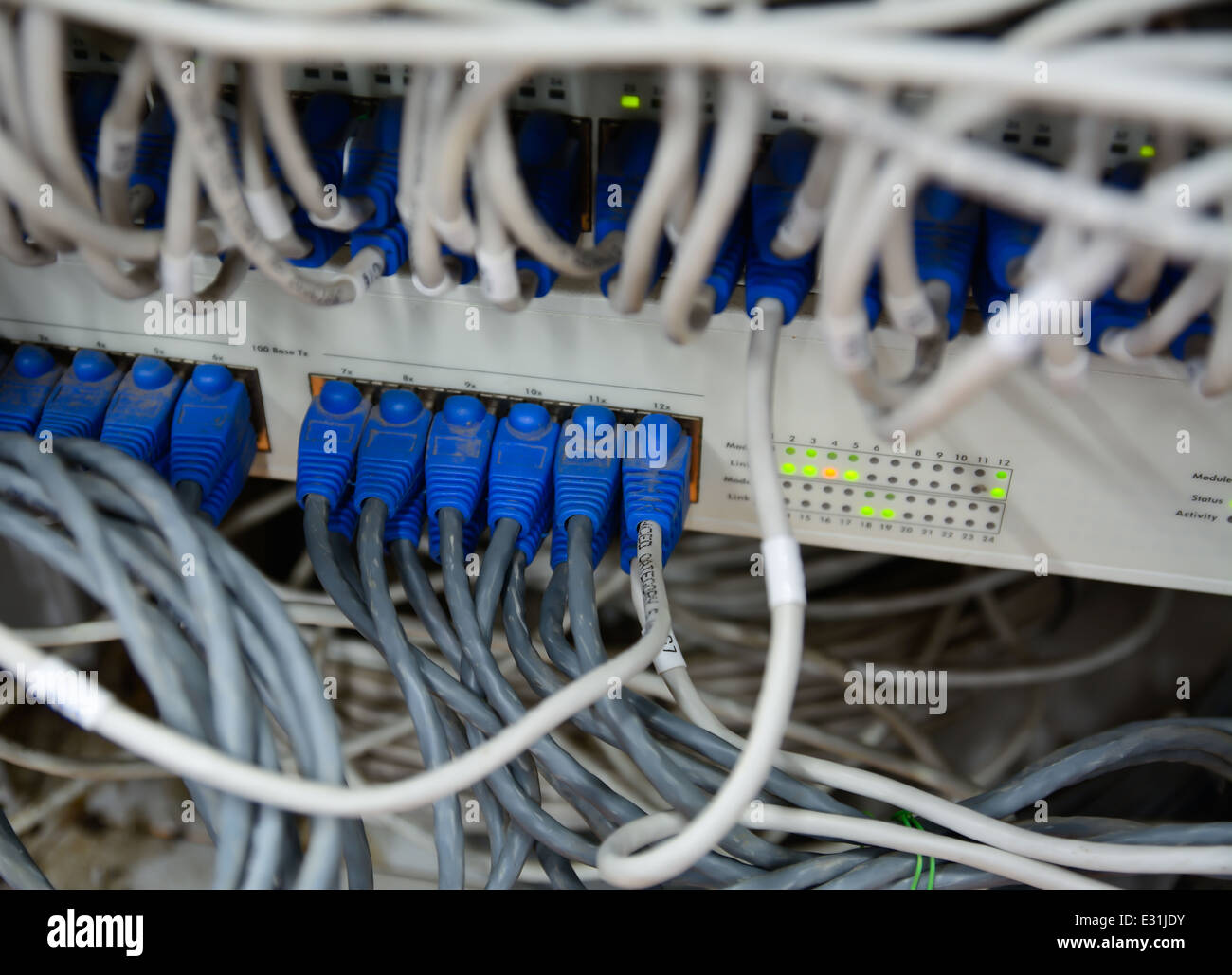close-up of ethernet cables connected to computer internet server with ...