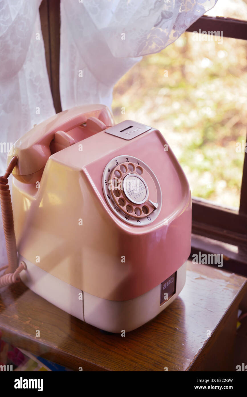Cute pink vintage telephone at a booth in Japan Stock Photo - Alamy