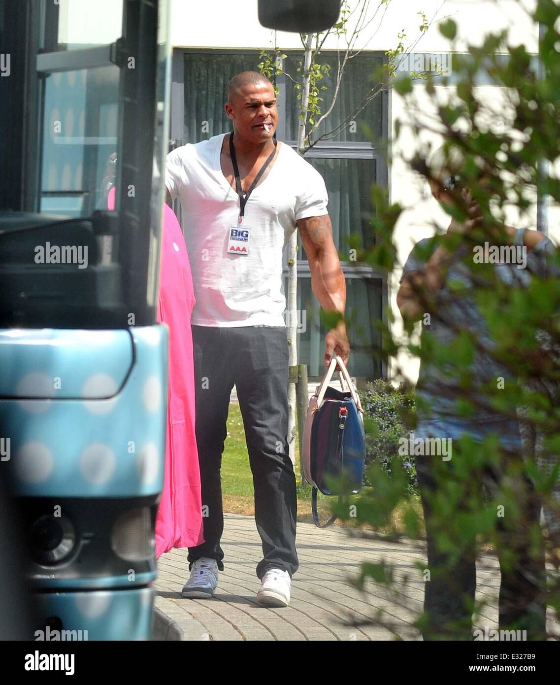 Kerry Katona's fiance George Kay carries her luggage to board the Big ...