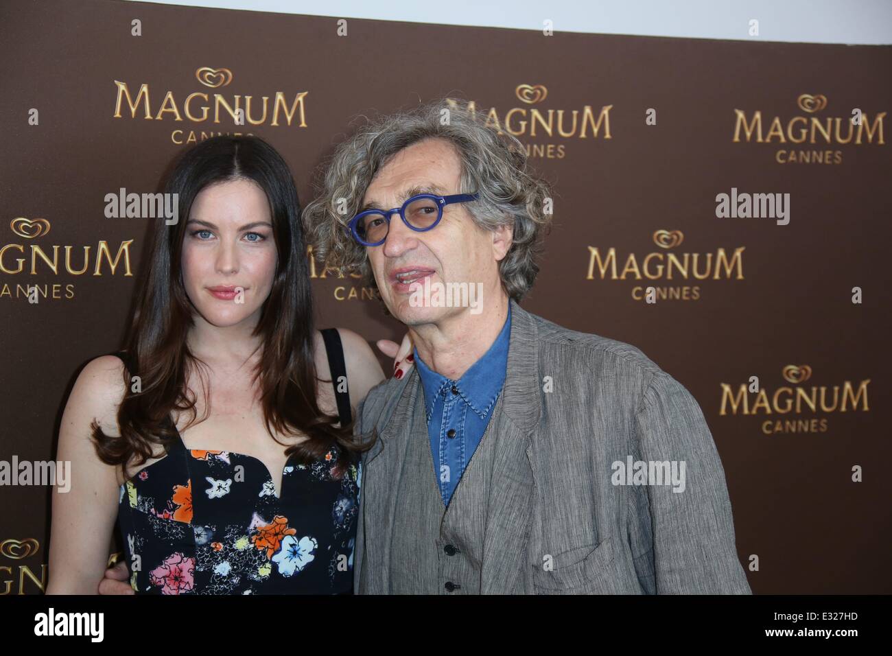 Liv Tyler and Wim Wenders posing at Magnum Ice-Cream's Beach during the ...