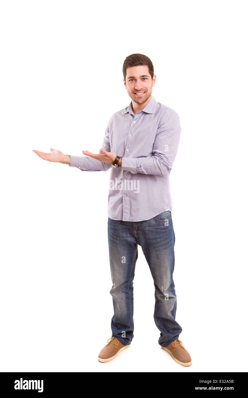 Young man presenting your product, isolated over a white background ...