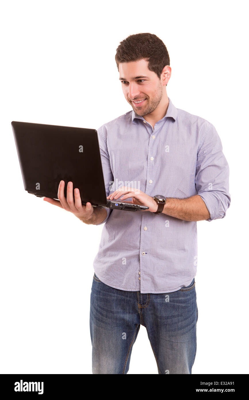 Young handsome man working with laptop computer Stock Photo - Alamy
