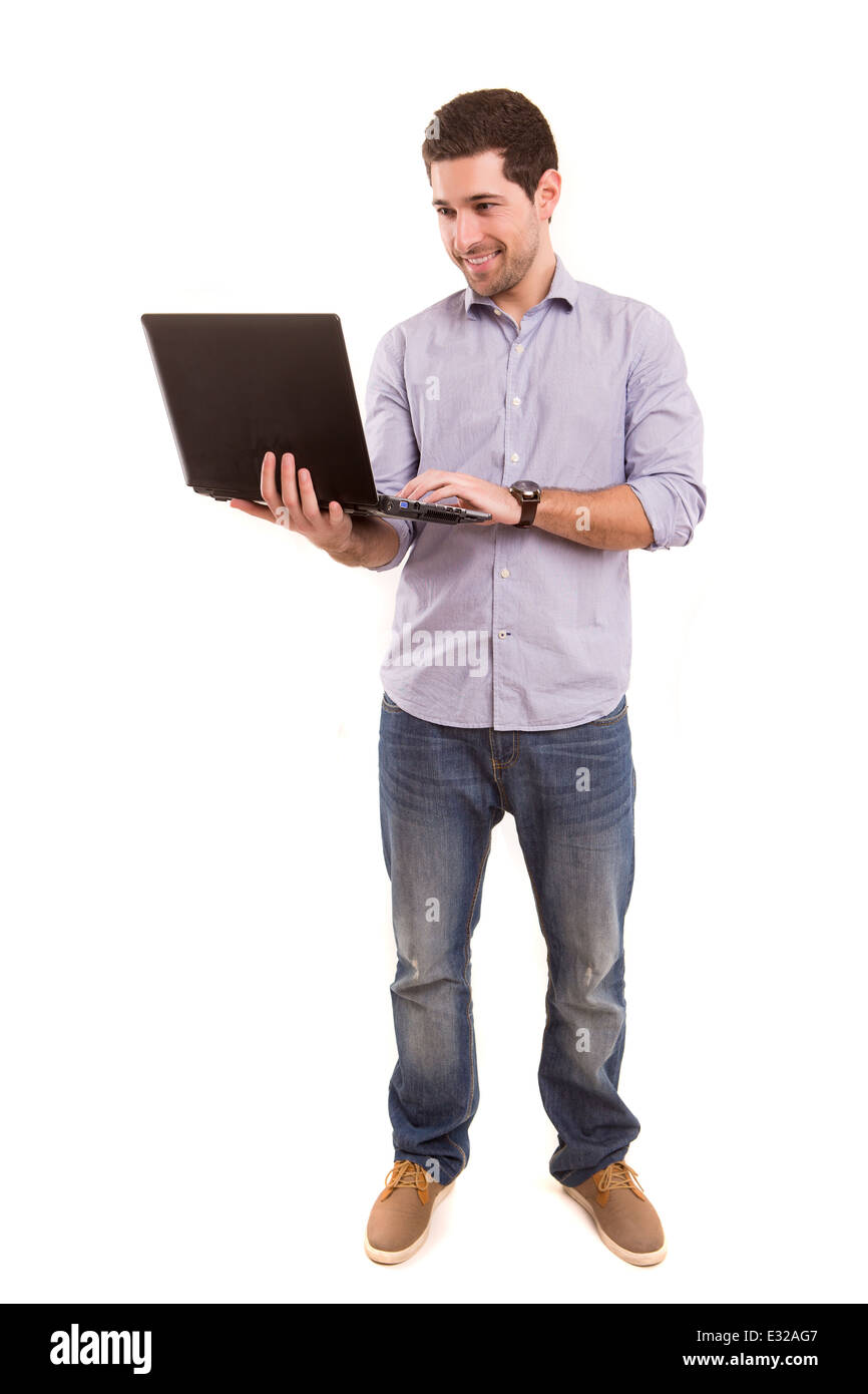 Young handsome man working with laptop computer Stock Photo - Alamy