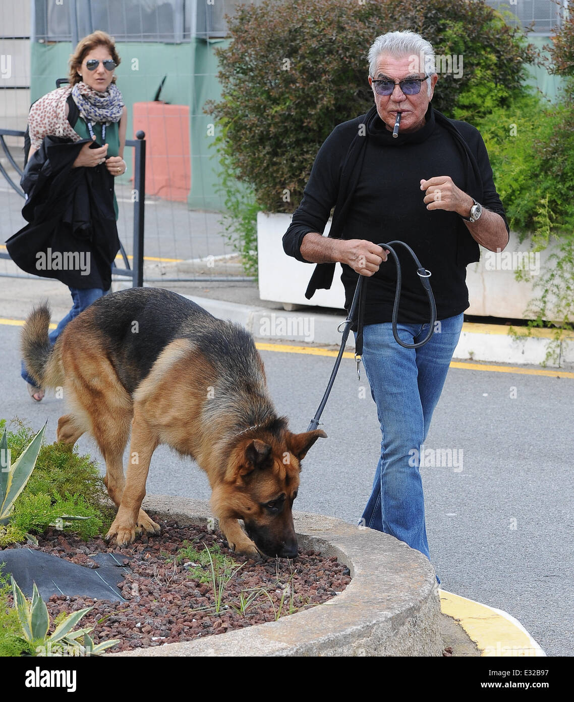 Roberto Cavalli takes his dog for a walk during the 66th Cannes Film ...