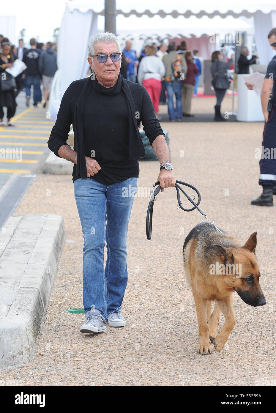 Roberto Cavalli takes his dog for a walk during the 66th Cannes Film ...