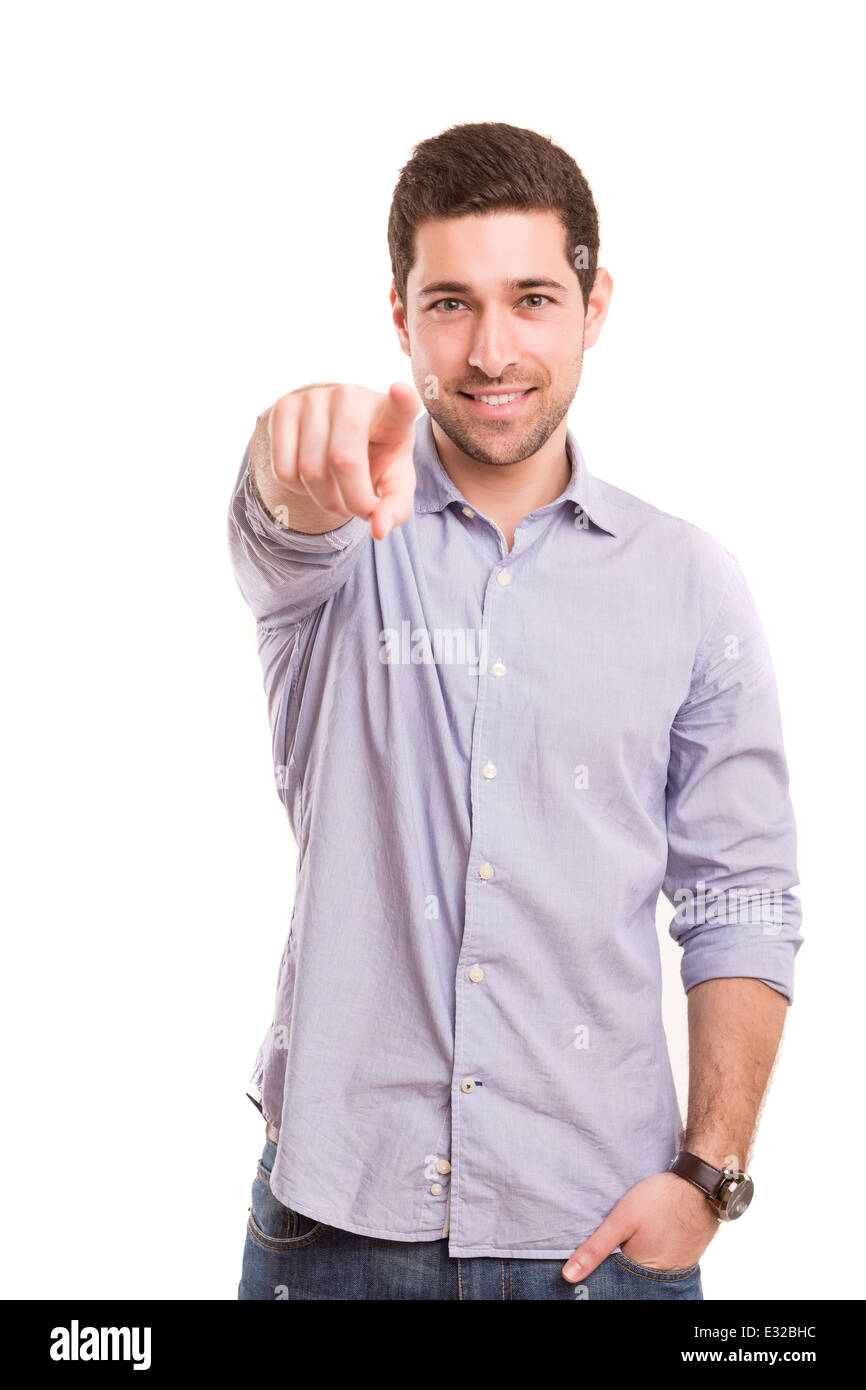 Handsome young man pointing at you, isolated over white background ...