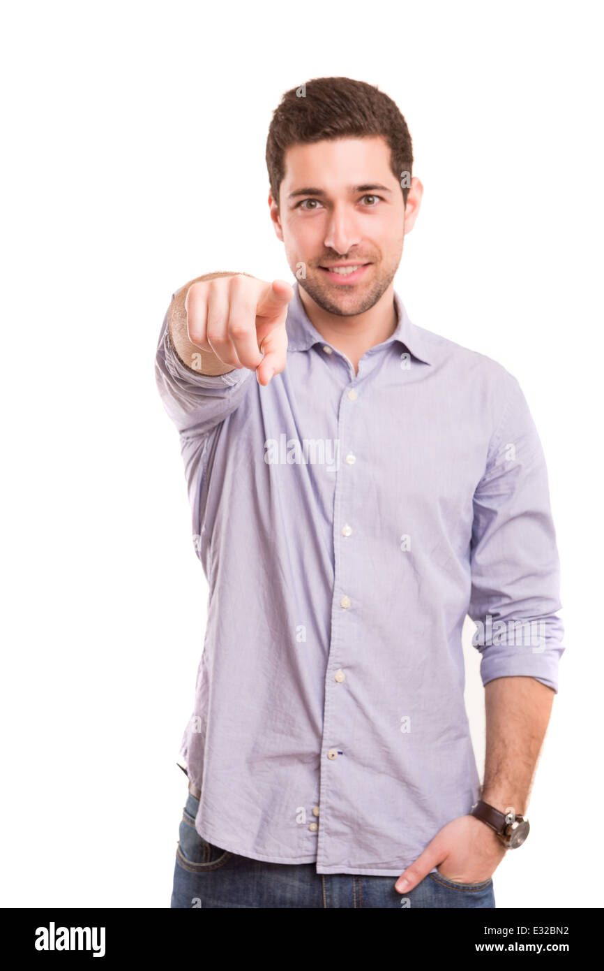 Handsome young man pointing at you, isolated over white background ...