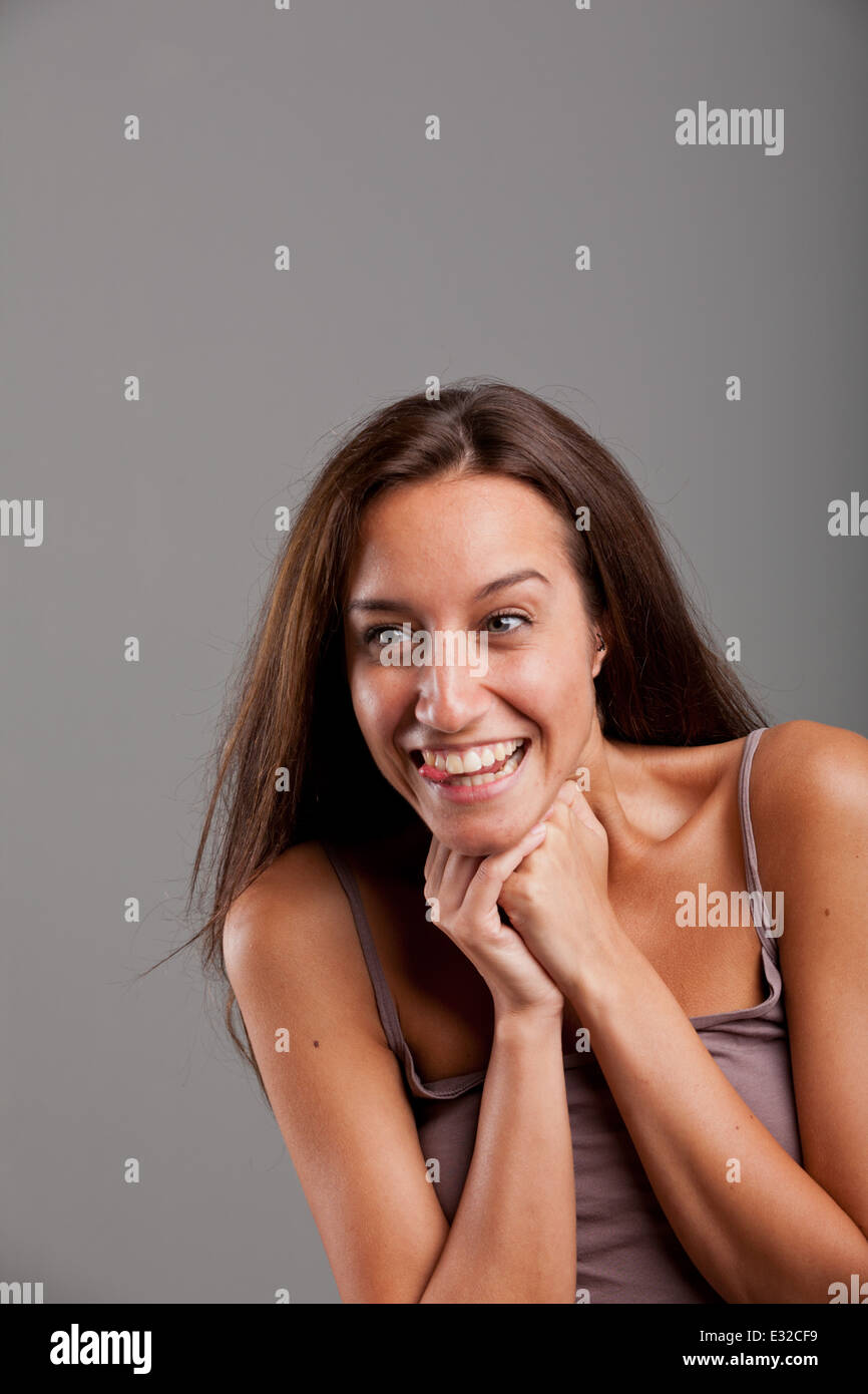 a smiling girl delighted about something gorgeous or a delicacy Stock ...