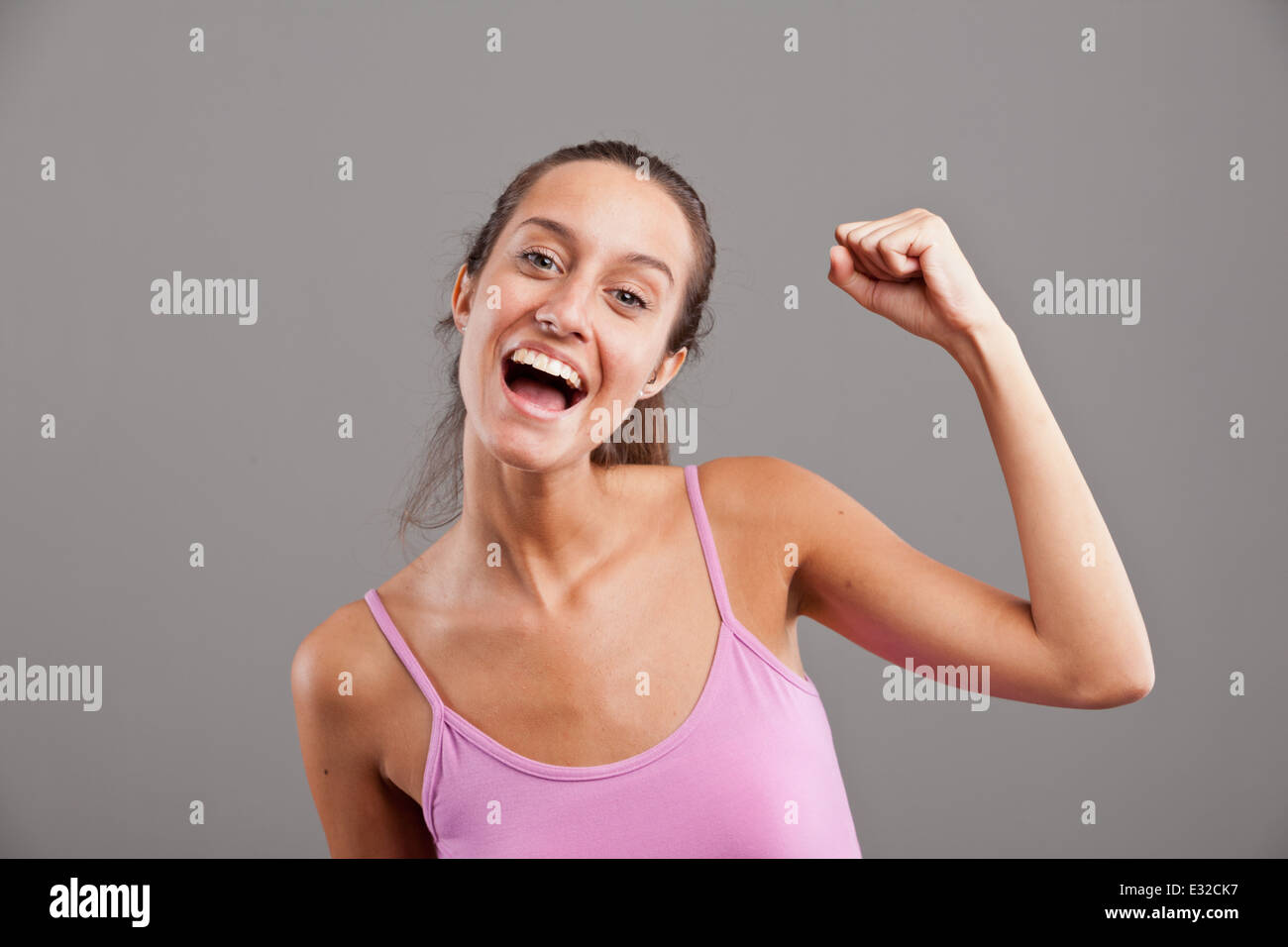 exulting girl because of something succesful or winning fact with an ...