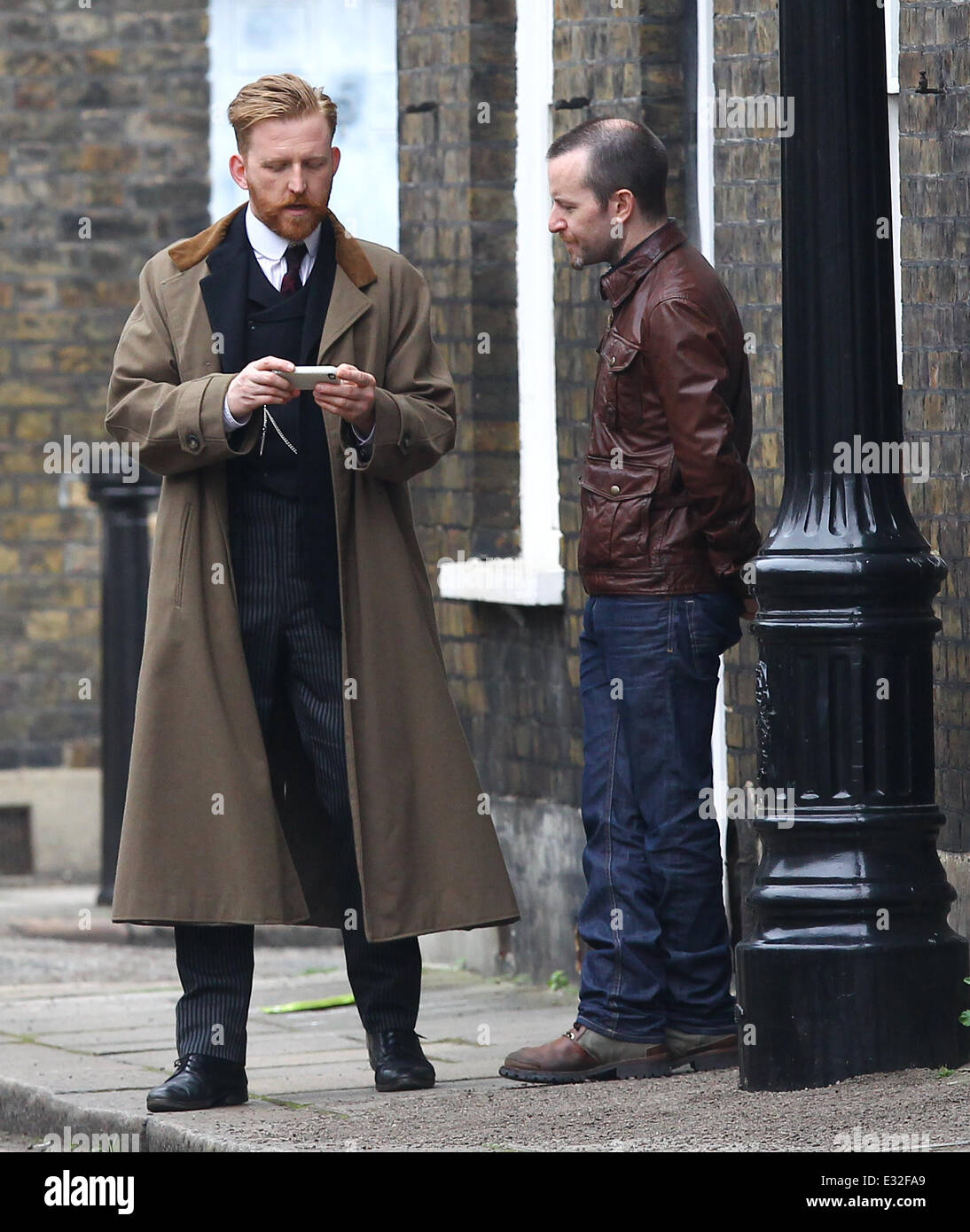 Cast and crew filming a scene on location in South London for the new ...
