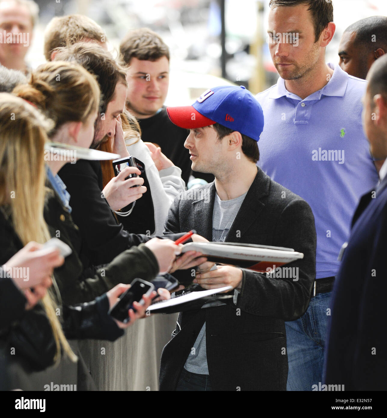 Daniel Radcliffe seen arriving and signing autographs at BBC studios ...