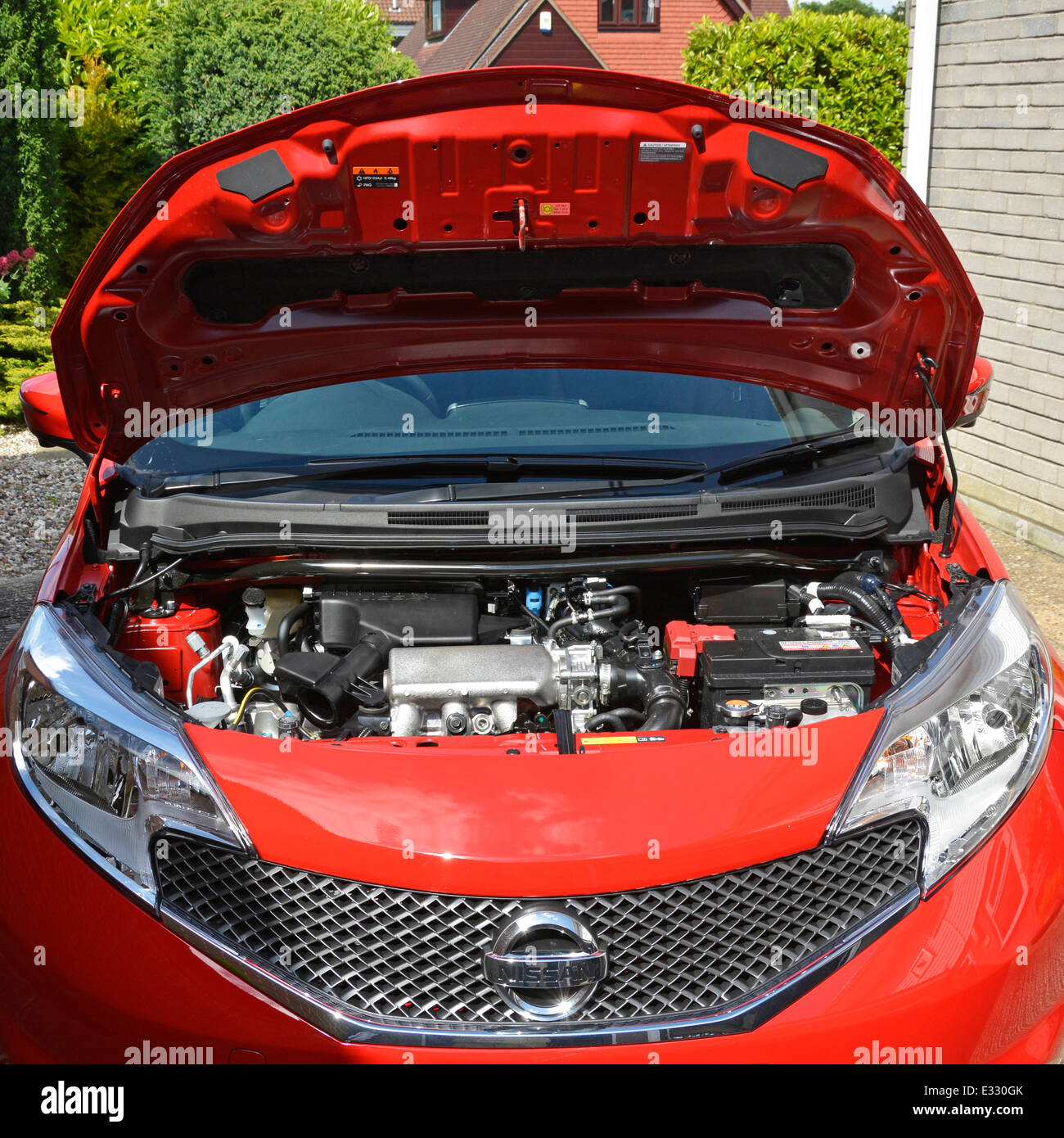 Raised bonnet of a Nissan Note Tekna super mini hatchback car showing a ...