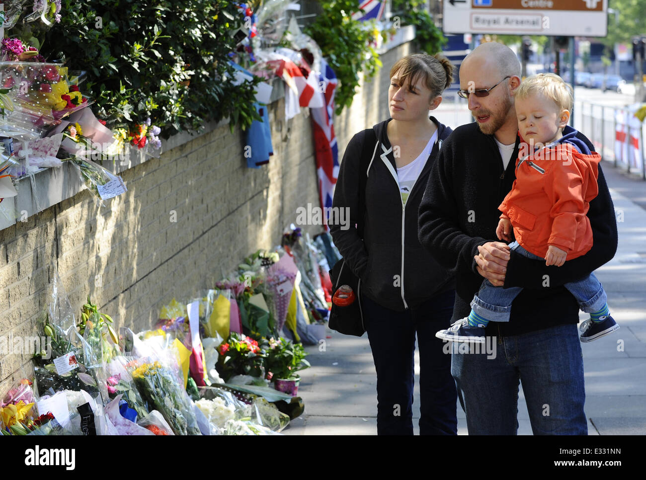 Members of the public lay flowers and pay their respects at the scene ...