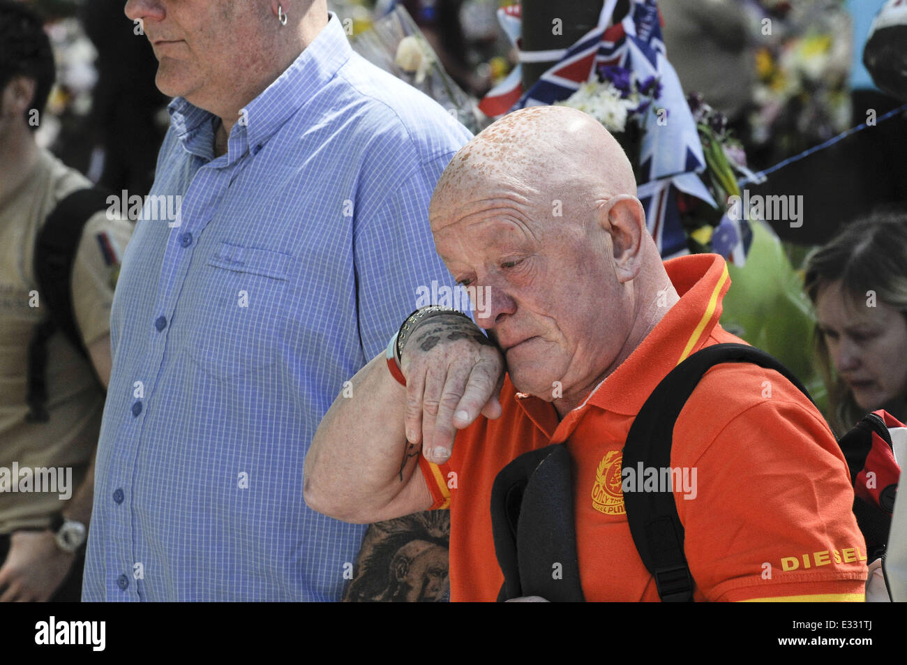 Members of the public lay flowers and pay their respects at the scene ...