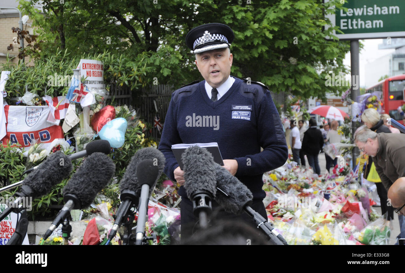Police hand out flyers that appeal for information about the Woolwich ...