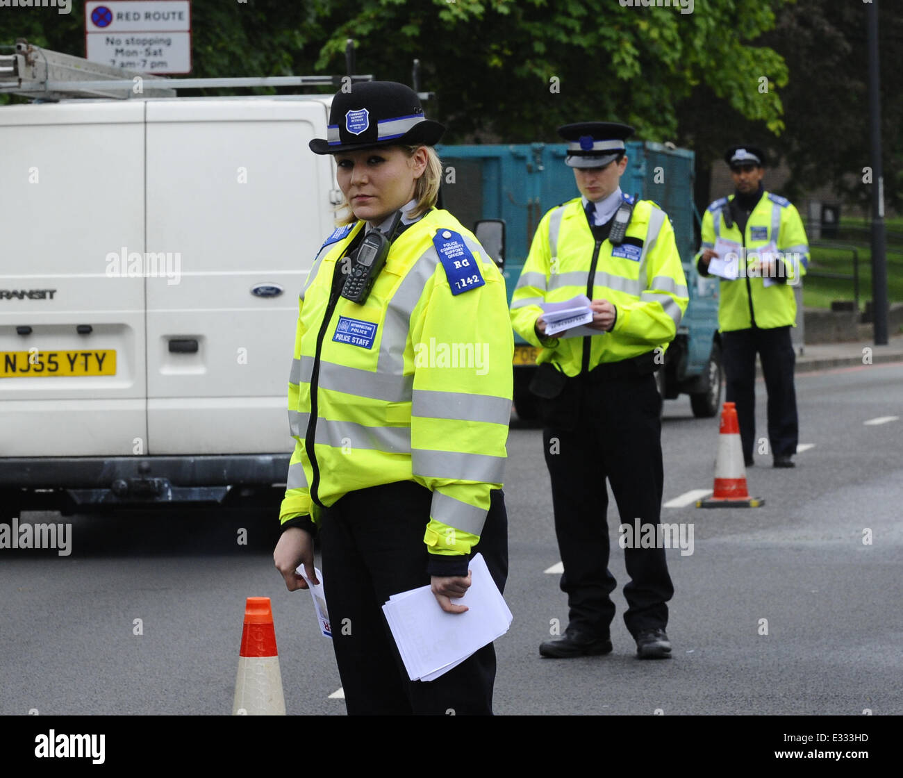 Police hand out flyers that appeal for information about the Woolwich ...