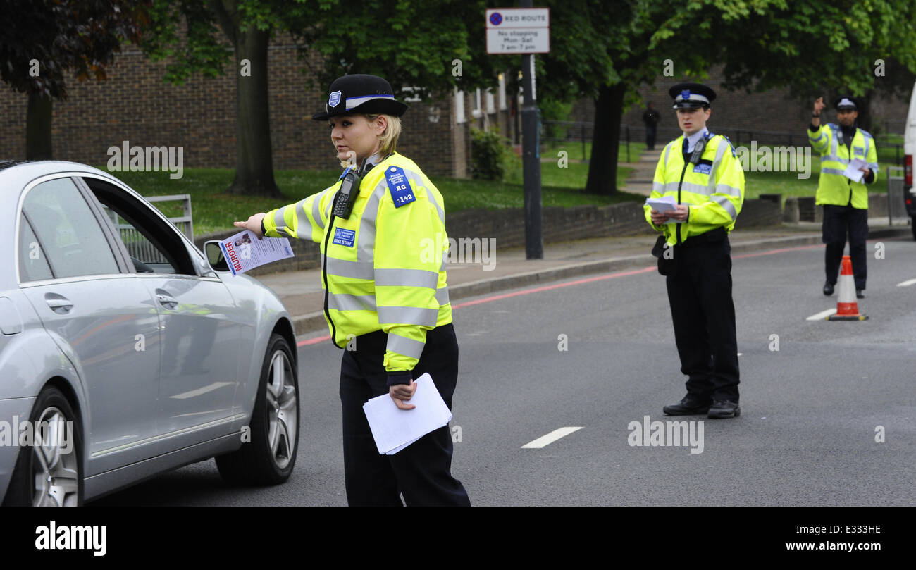 Police hand out flyers that appeal for information about the Woolwich ...