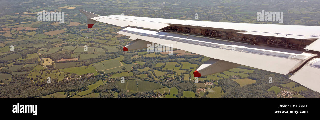 Close up of aircraft wing controls being operated to help adjust the ...