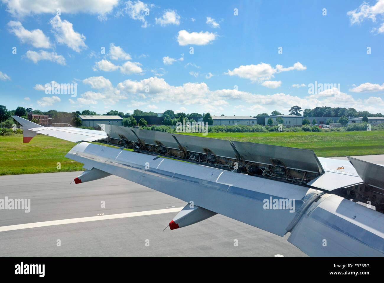 Close up of aircraft wing controls being operated to help adjust the ...