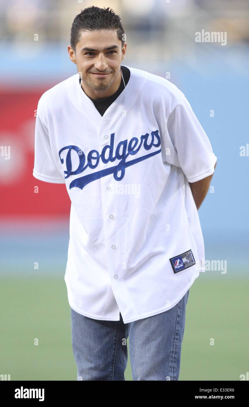 Boxer Josesito Lopez throws the first pitch before the game between San ...