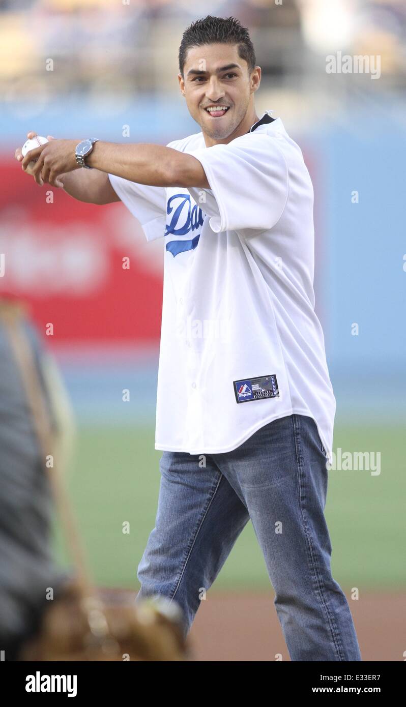 Boxer Josesito Lopez throws the first pitch before the game between San ...
