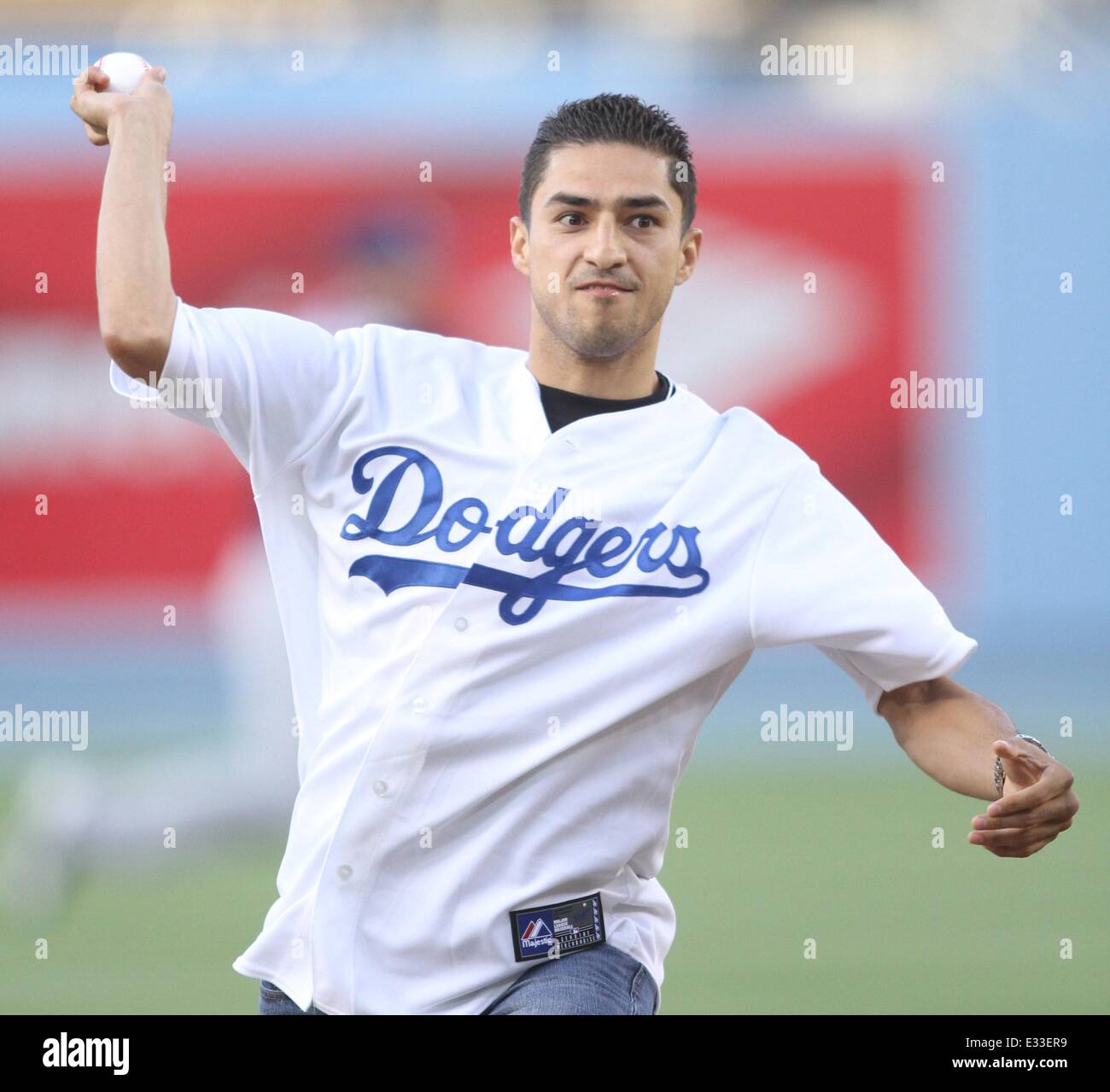 Boxer Josesito Lopez throws the first pitch before the game between San ...