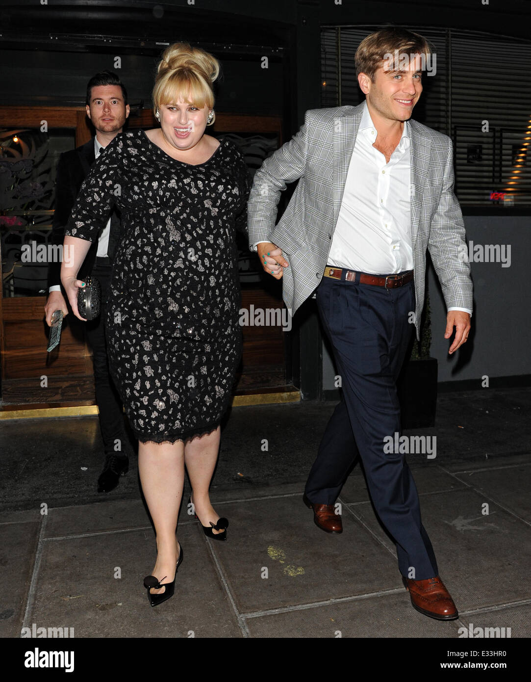 Rebel Wilson and a friend holds hands as they leave the Groucho Club in ...