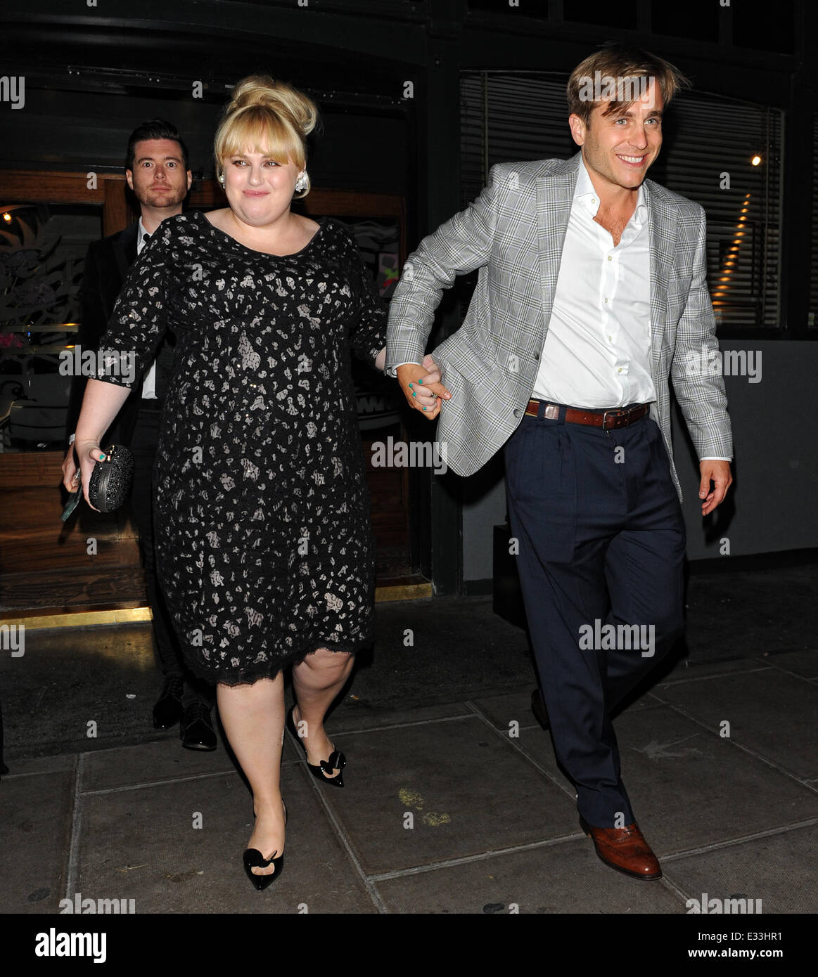 Rebel Wilson and a friend holds hands as they leave the Groucho Club in ...