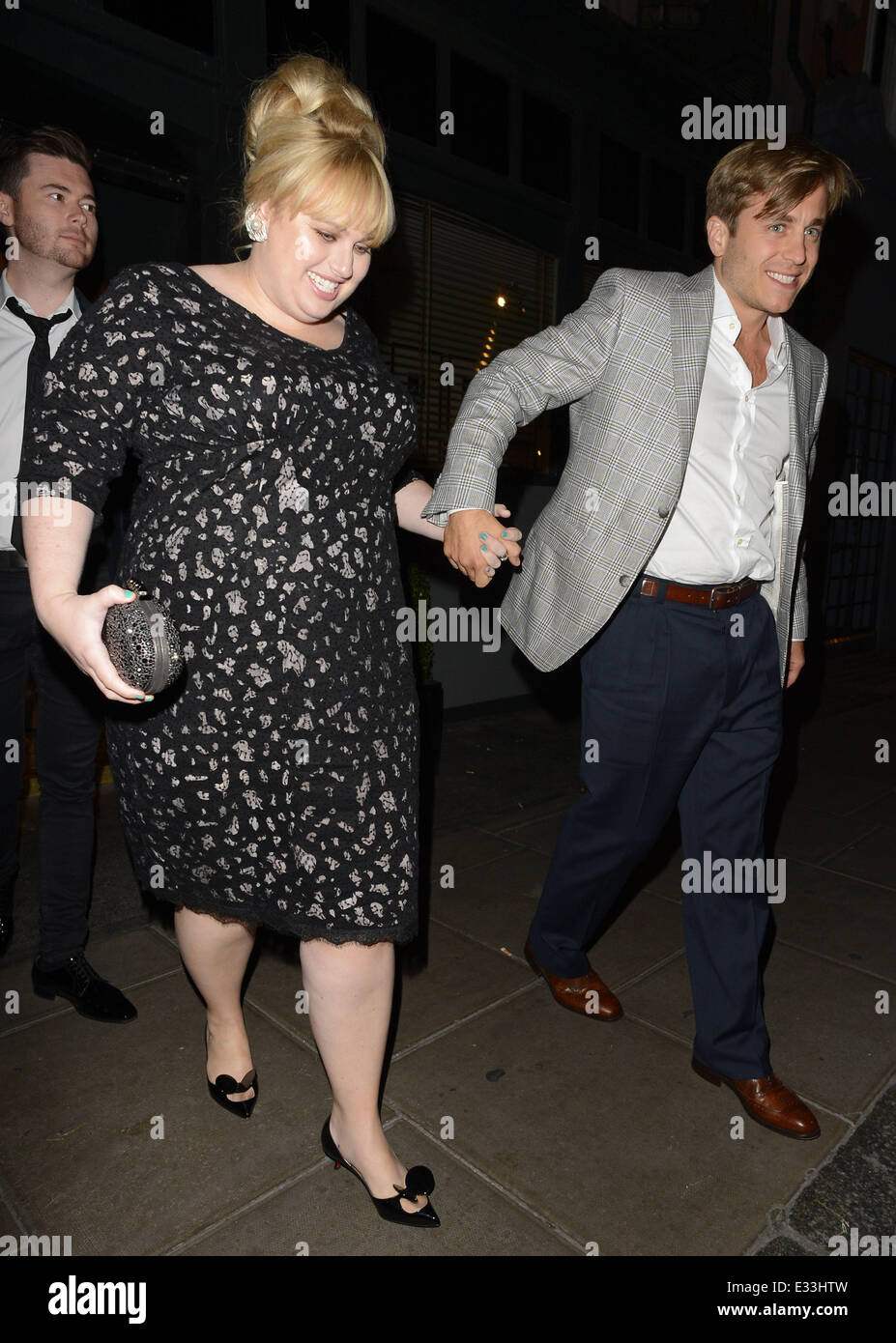 Rebel Wilson and a friend hold hands as they leave the Groucho Club in ...