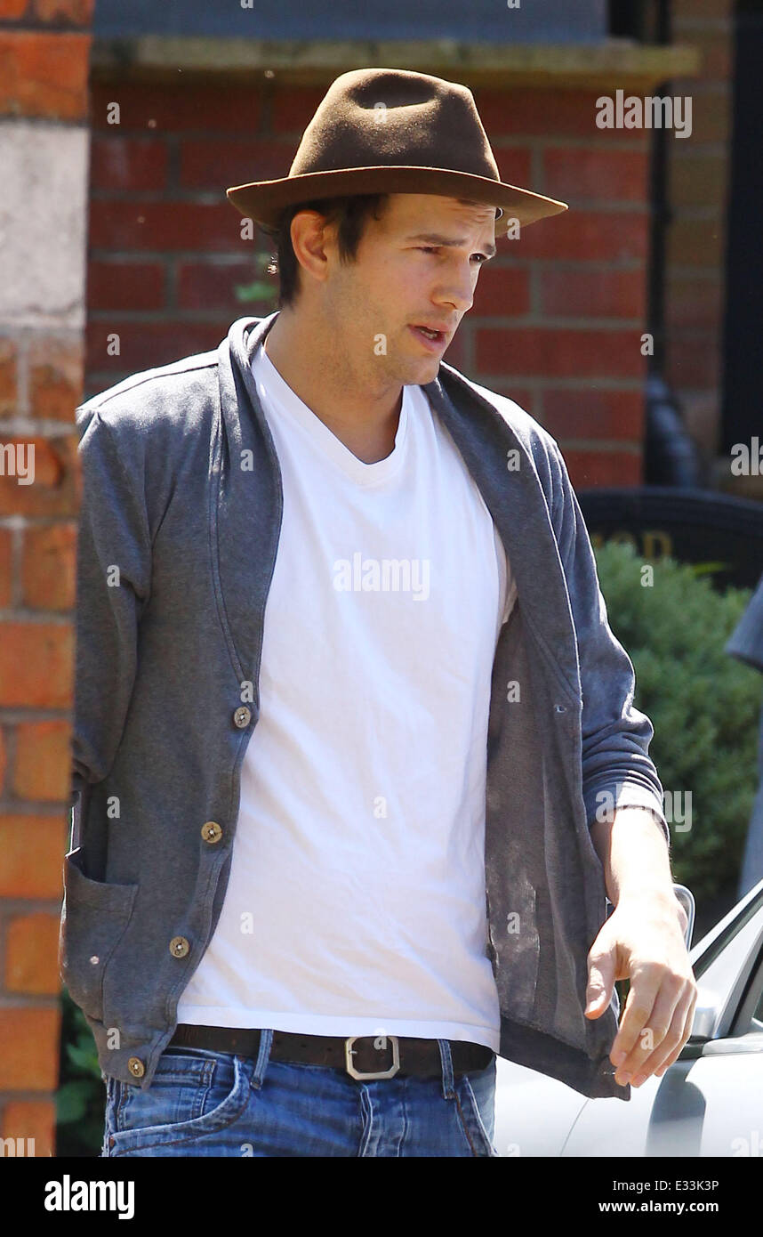 Ashton Kutcher leaving his rented London home, wearing a brown felt ...