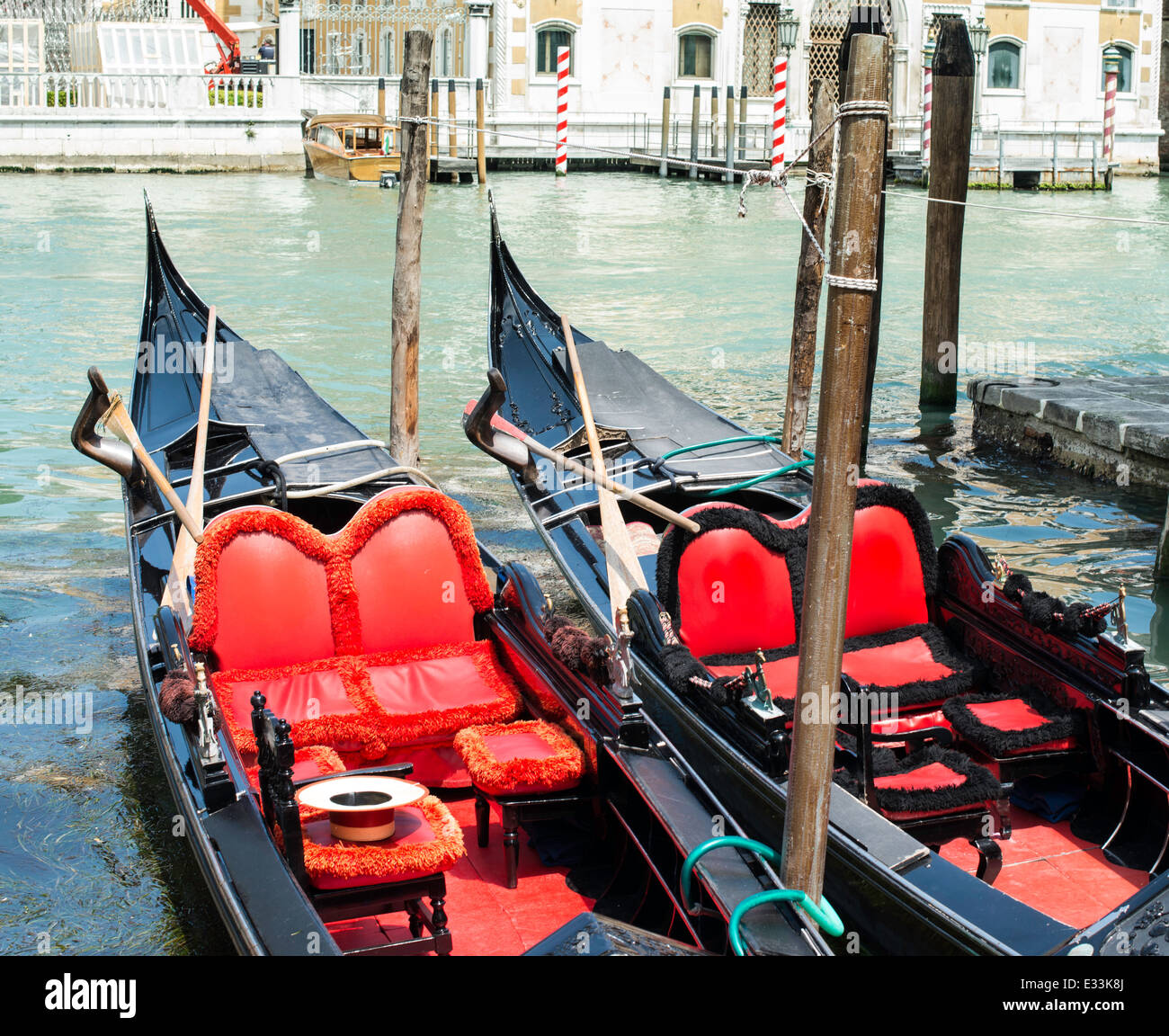 Ancient gondolas boat in Venice. Gondola red color interior Stock Photo ...