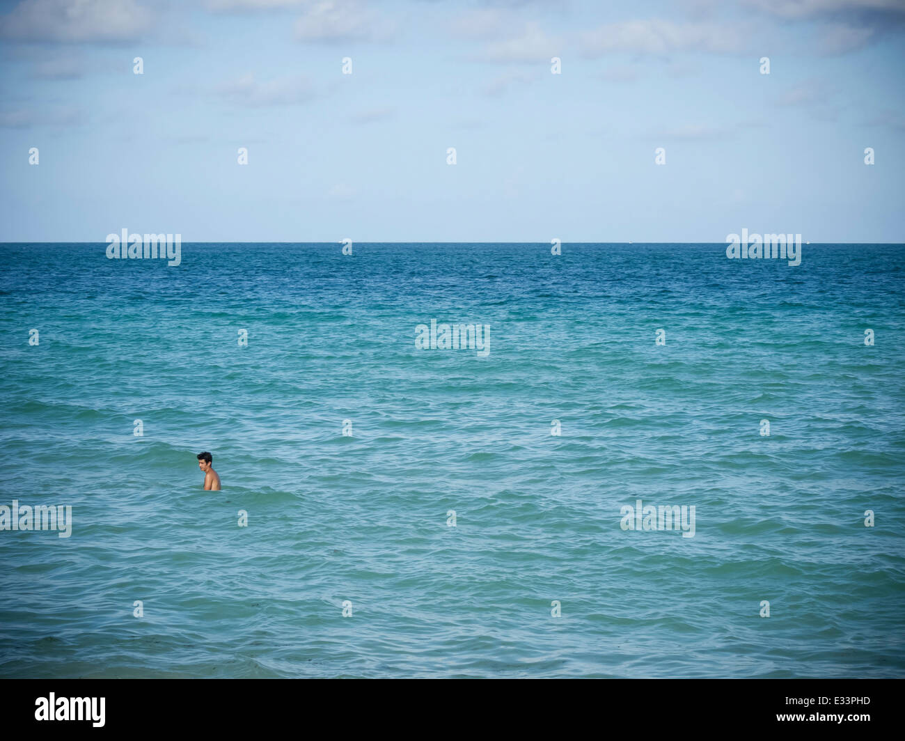 Lone swimmer at Miami Beach Stock Photo - Alamy