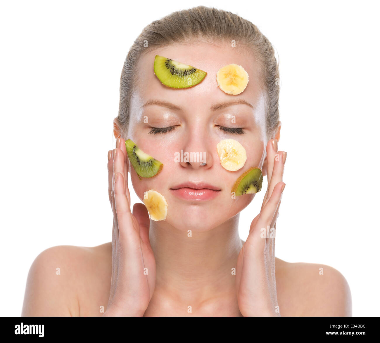 Young woman making fruit facial mask Stock Photo - Alamy