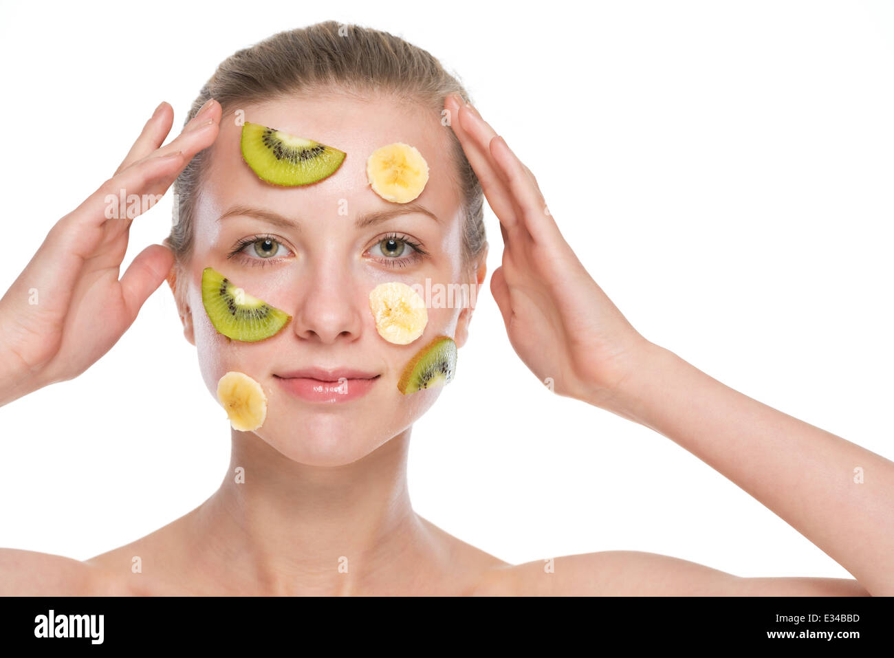 Young woman making fruit facial mask Stock Photo - Alamy