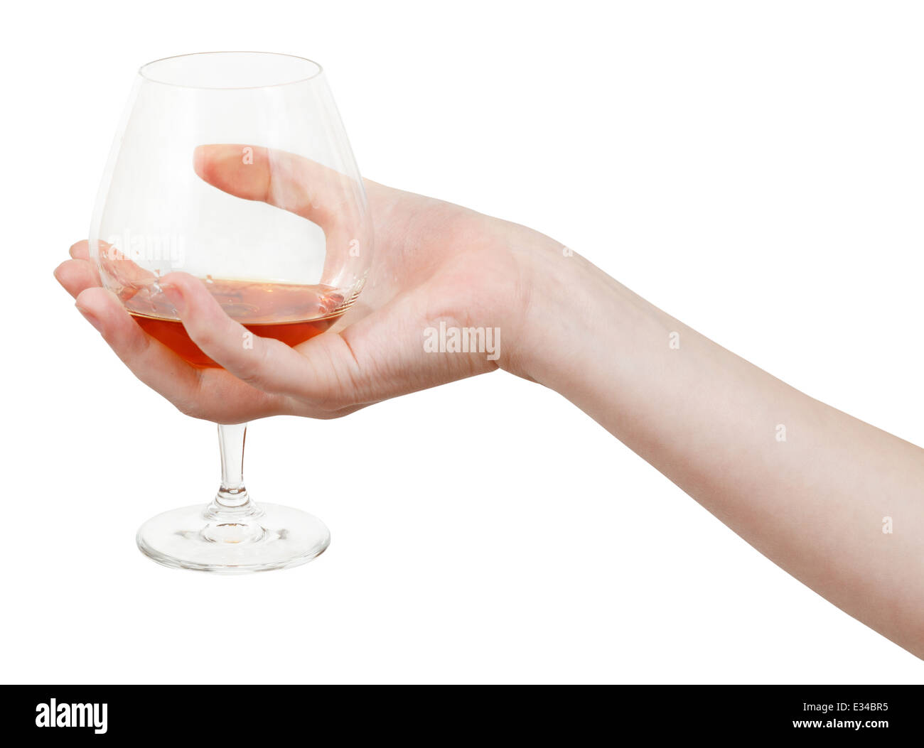 hand holds glass goblet with brandy isolated on white background Stock ...