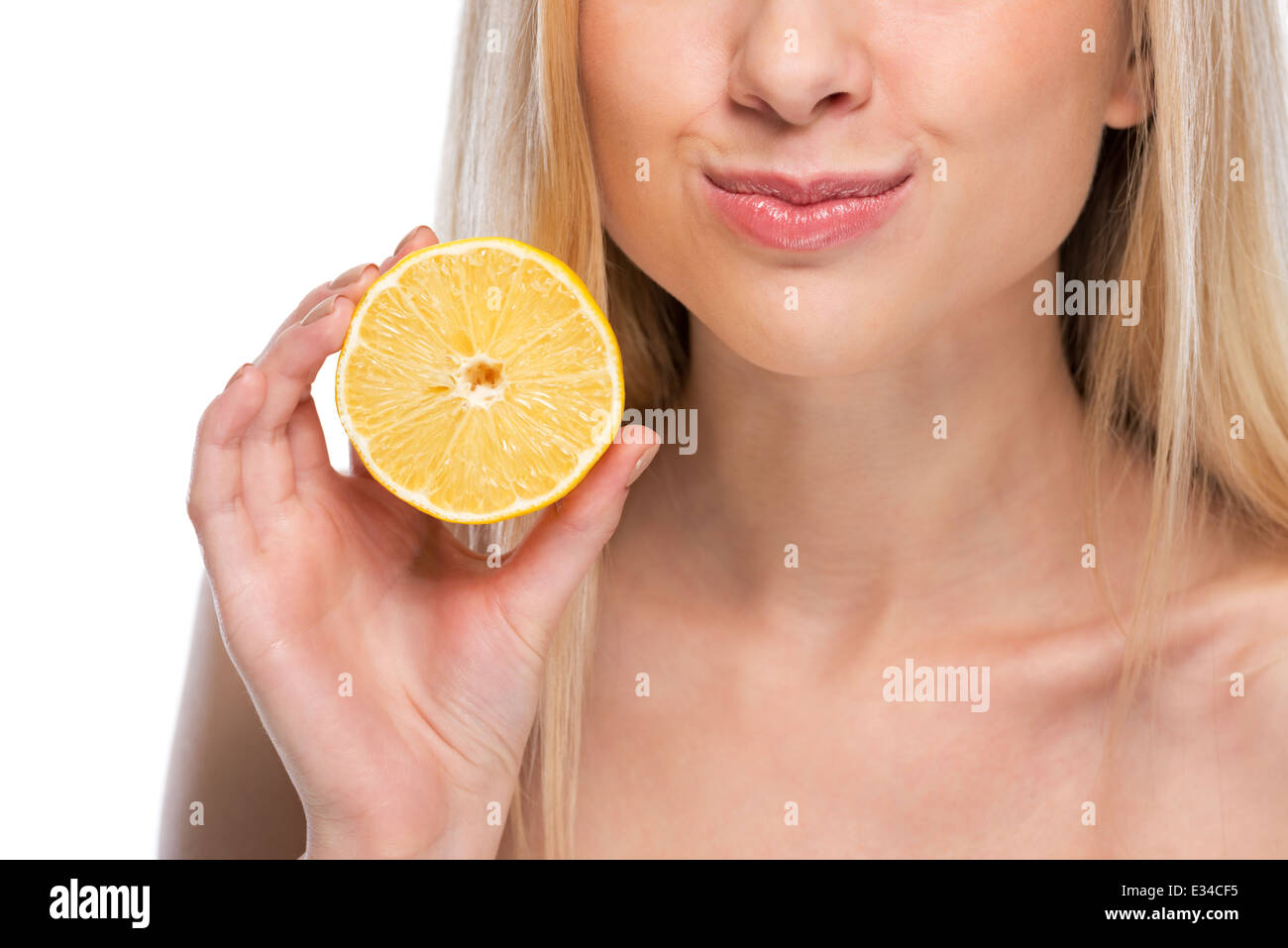 Closeup on teenager showing lemon Stock Photo - Alamy