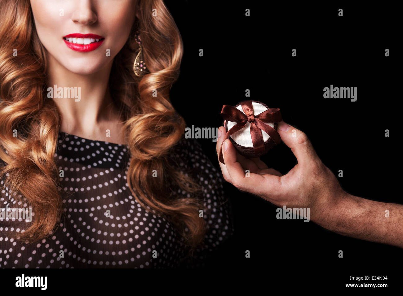 Man gives a present Stock Photo - Alamy