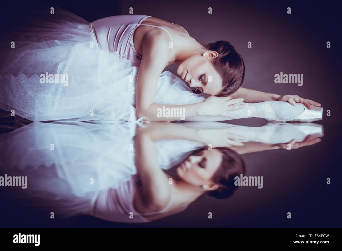 Lying ballerina with reflection on the mirror Stock Photo - Alamy