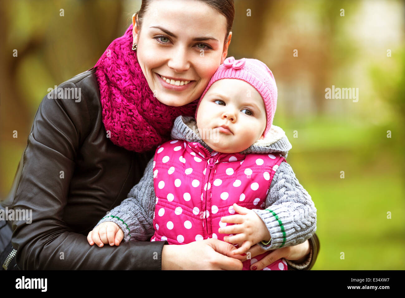 beautiful young mother daughter relaxing sitting grass background ...