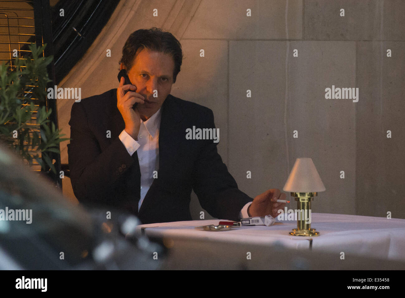 Charles Saatchi alone at Scott's restaurant talking on his mobile phone ...