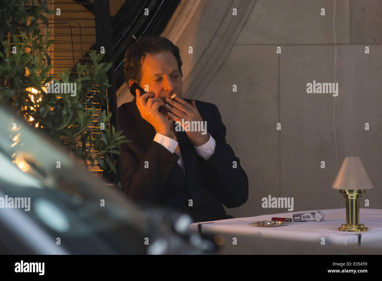 Charles Saatchi alone at Scott's restaurant talking on his mobile phone ...