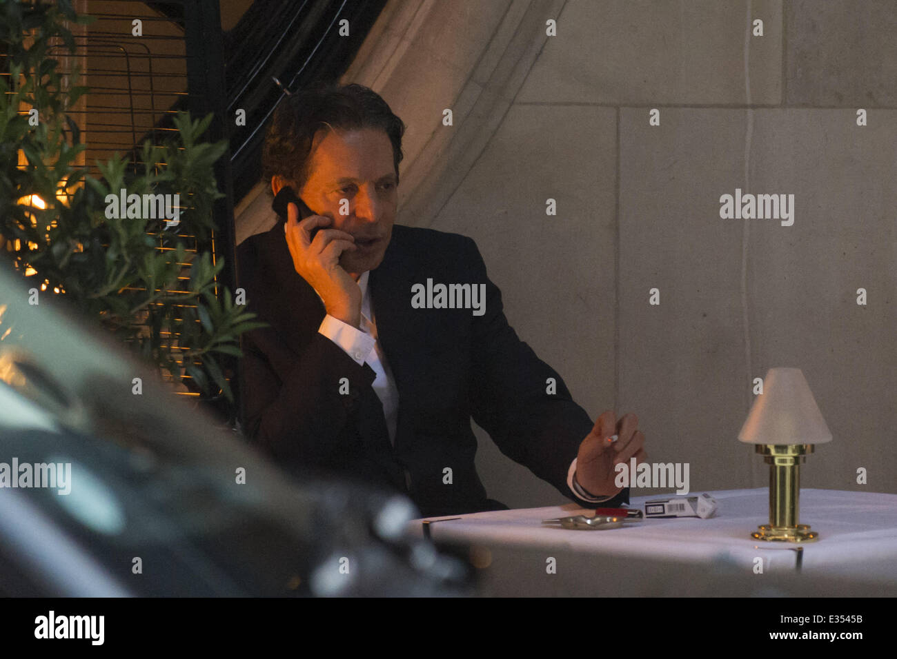 Charles Saatchi alone at Scott's restaurant talking on his mobile phone ...